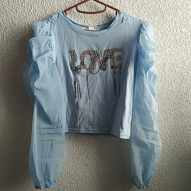 Blusa azul bebé con mangas y lentejuelas de Otras marcas de segunda ...